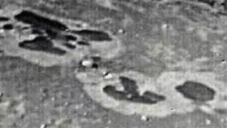 UFOlogisten hunn eng méiglech Basis vun der Aliens op de gréisste Satellit fonnt