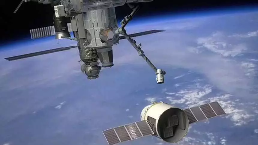 Dragon docks to the ISS September 23