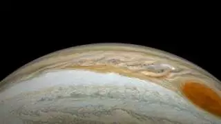 Juno received new photos of a large red spot on Jupiter
